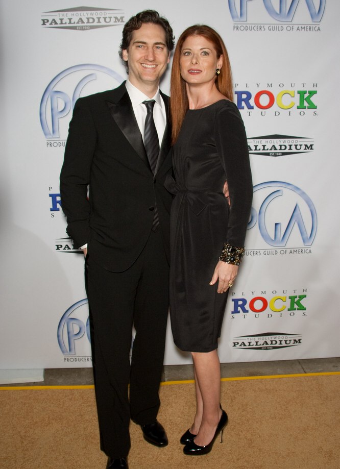 Debra Messing wearing her hair center parted and styled straight